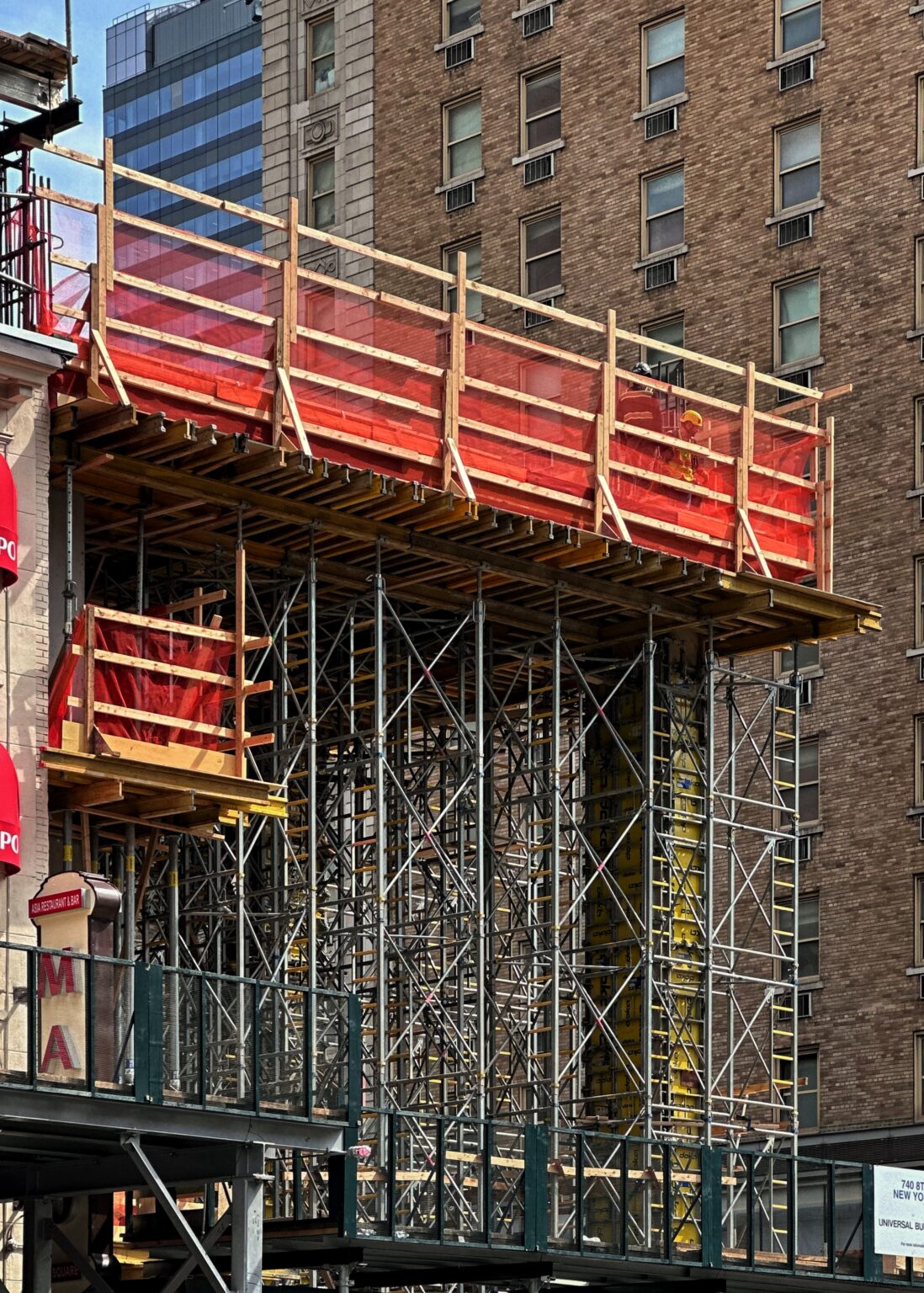 The Torch Begins Its Ascent at 740 Eighth Avenue in Times Square, Manhattan - New York YIMBY