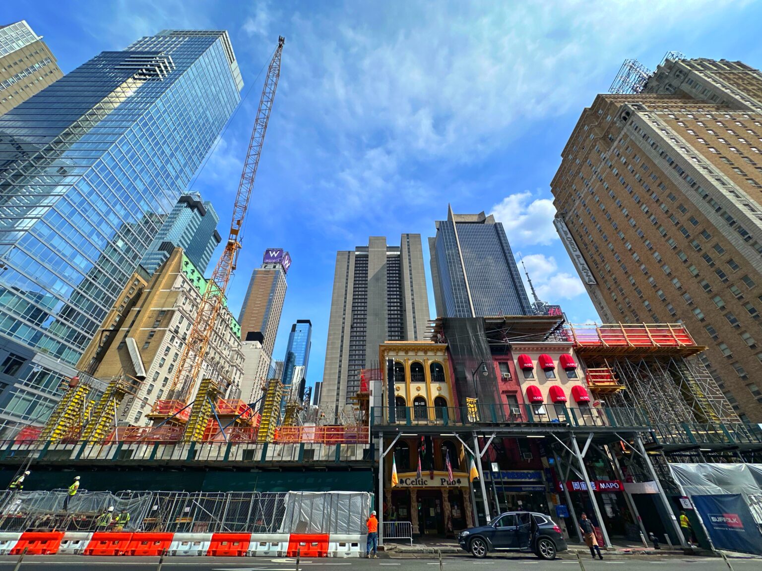 The Torch Begins Its Ascent at 740 Eighth Avenue in Times Square, Manhattan - New York YIMBY